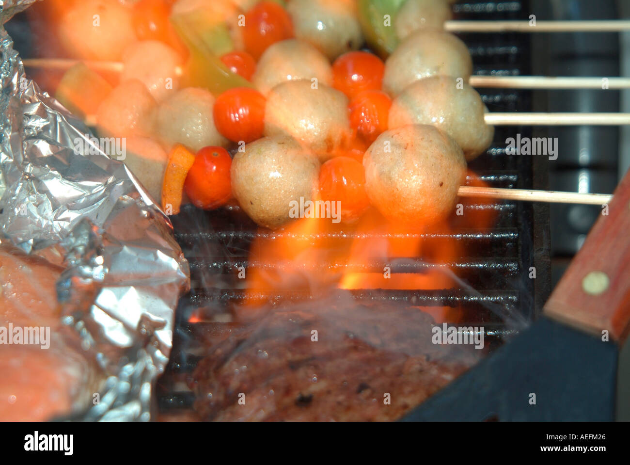 Food being cooked on barbecue grill Stock Photo - Alamy
