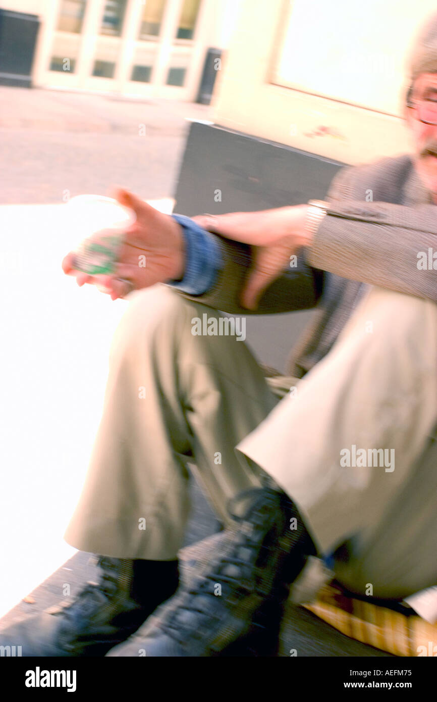 Homeless man begging for coins money in france street Stock Photo - Alamy