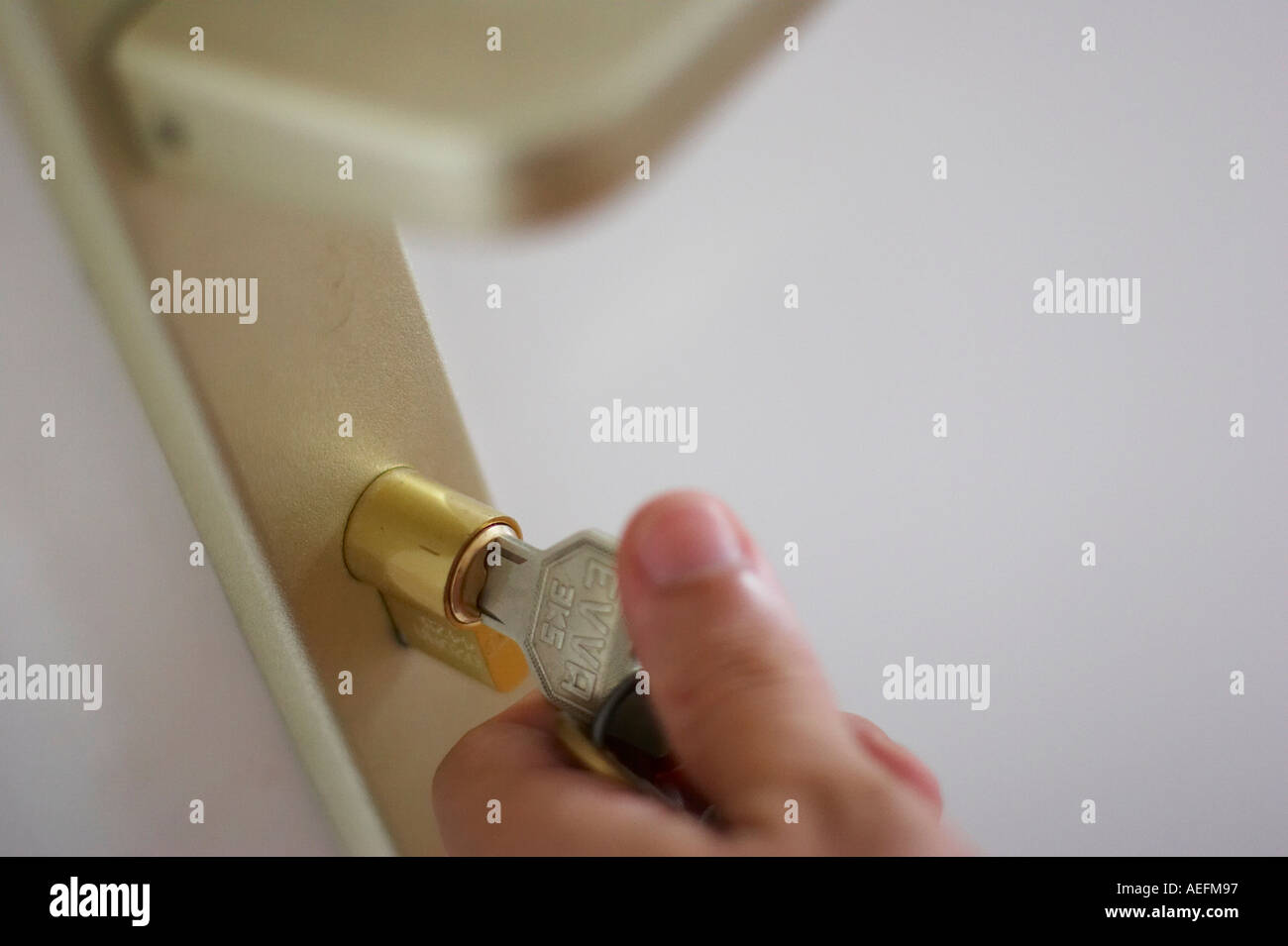 unlocking a door Stock Photo - Alamy