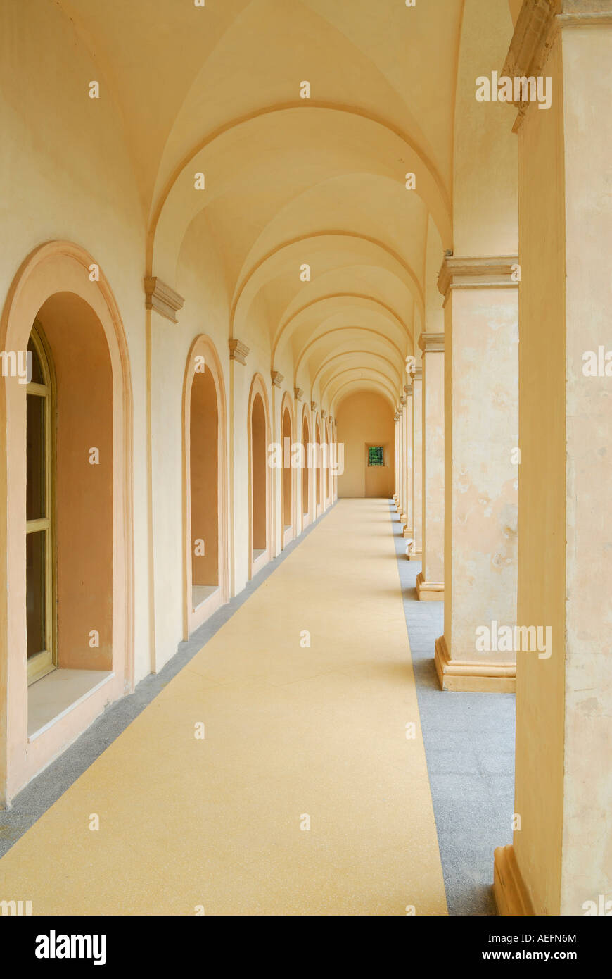 Hallway of columns arches and windows in yellow at La Rocca Papal ...