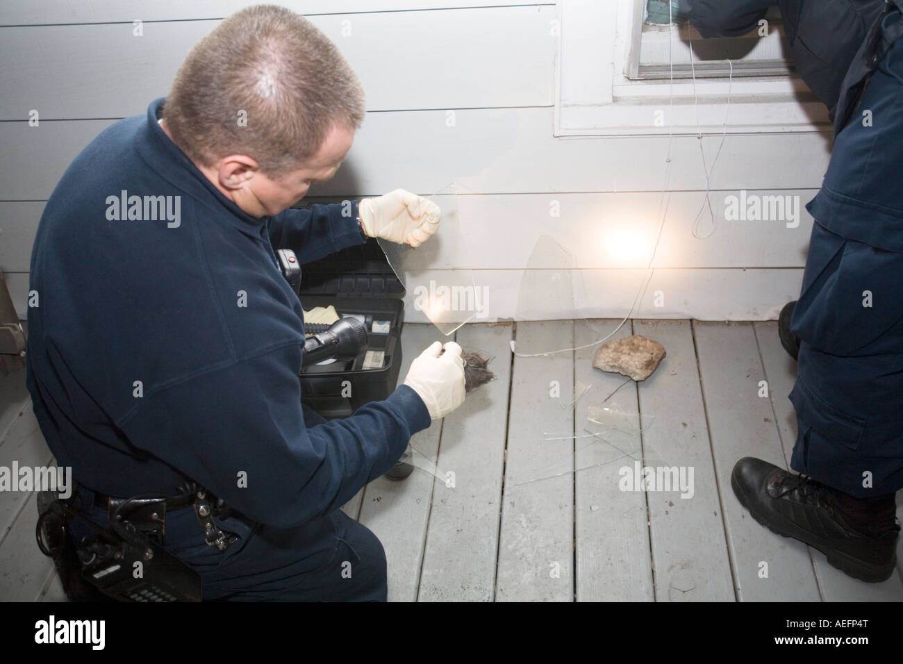 CSI investigating crime scene, looking for finger prints. Kansas City ...