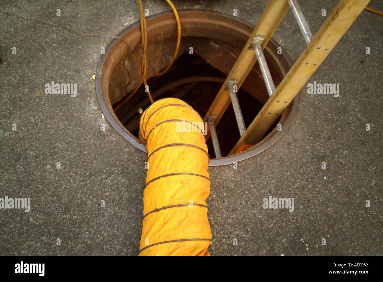 Open manhole cover Stock Photo - Alamy
