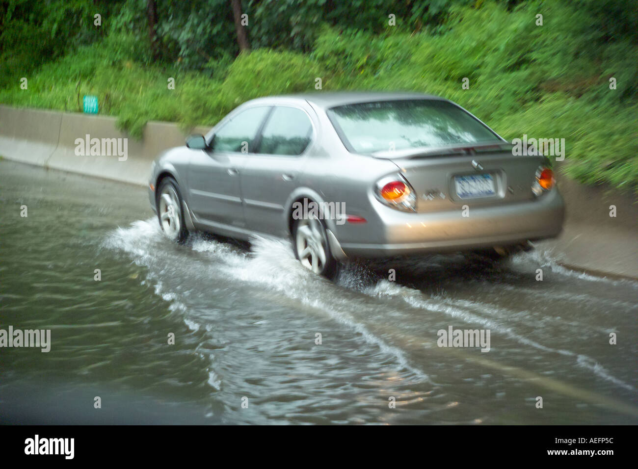 Car driving through water Stock Photo - Alamy