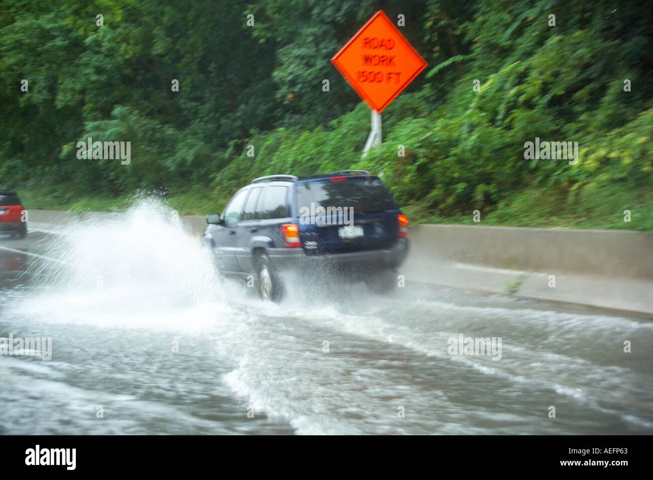 Cars driving through water Stock Photo - Alamy
