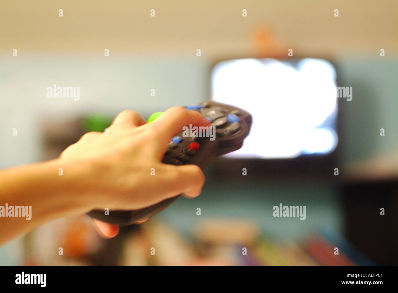 Hand on Cable remote control Stock Photo - Alamy