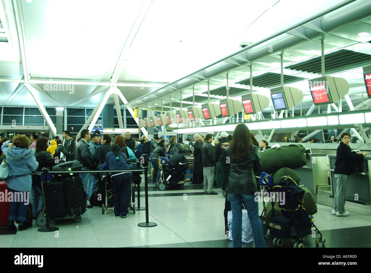 Waiting in line at airport Stock Photo - Alamy