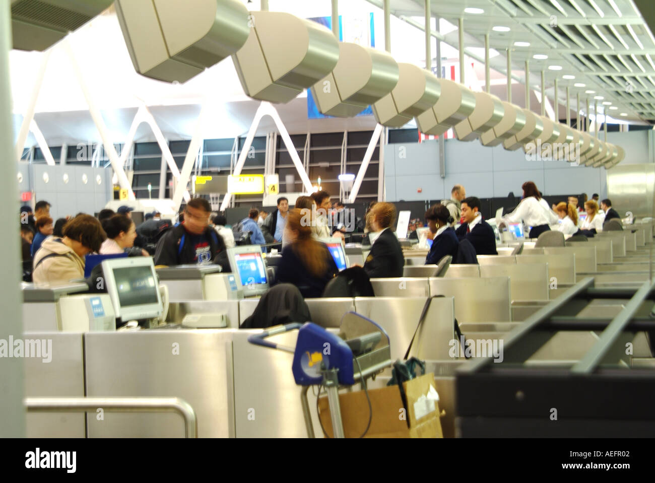 Check in counter at the airport Stock Photo - Alamy