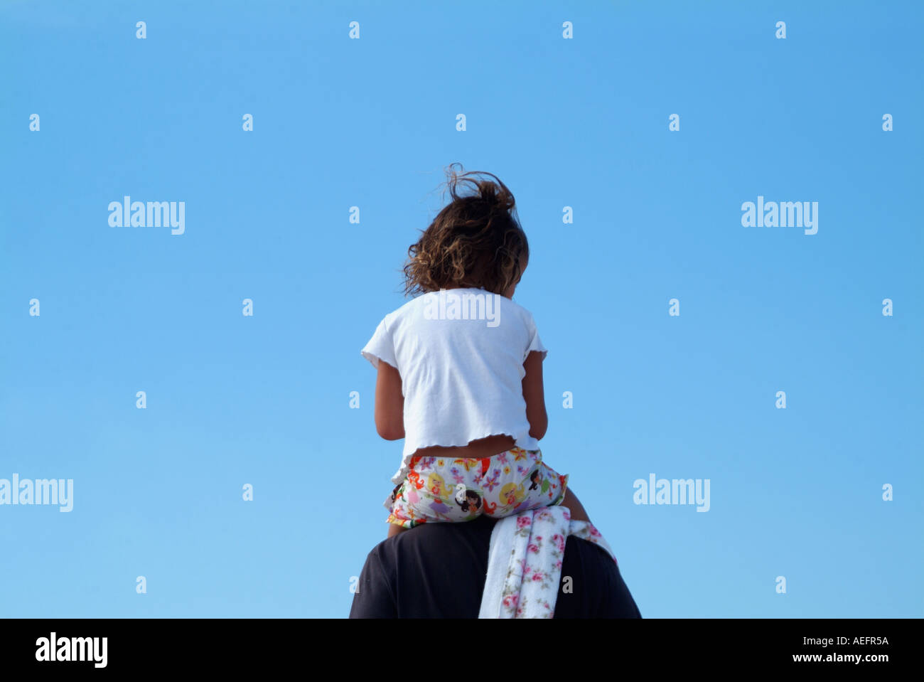 Little girl getting piggy back ride Stock Photo - Alamy