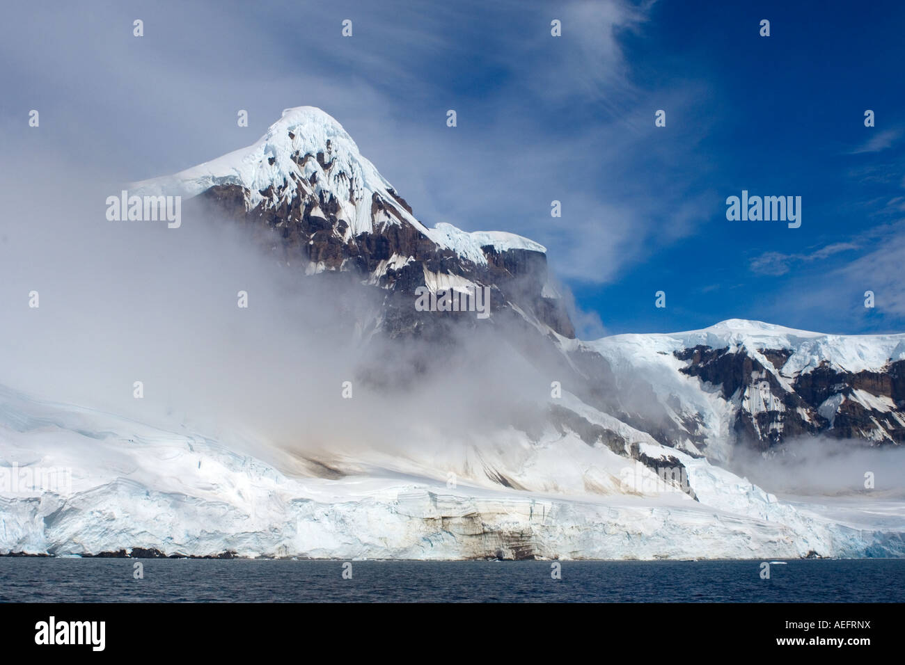 frozen glacial mountain landscape along the western Antarctic peninsula ...