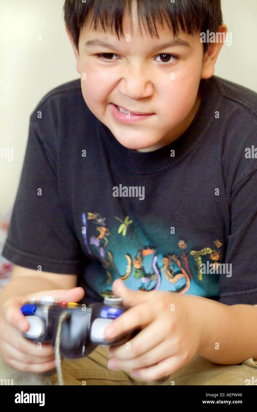 Boy playing Video game Stock Photo - Alamy