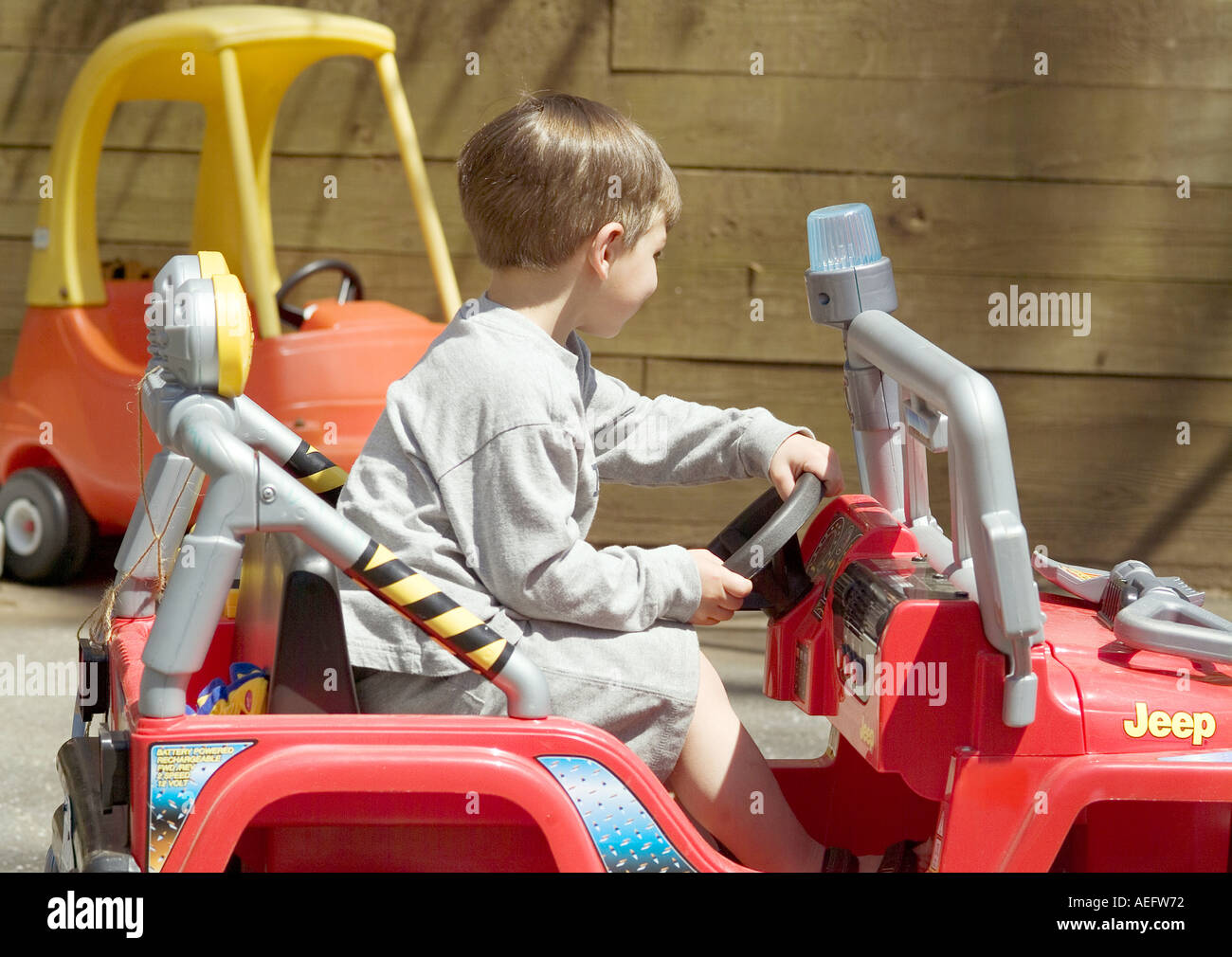 Boy driving toy car Stock Photo - Alamy