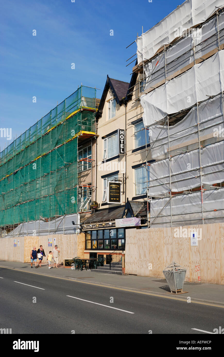 Properties being renovated each side of a seafront hotel on the ...