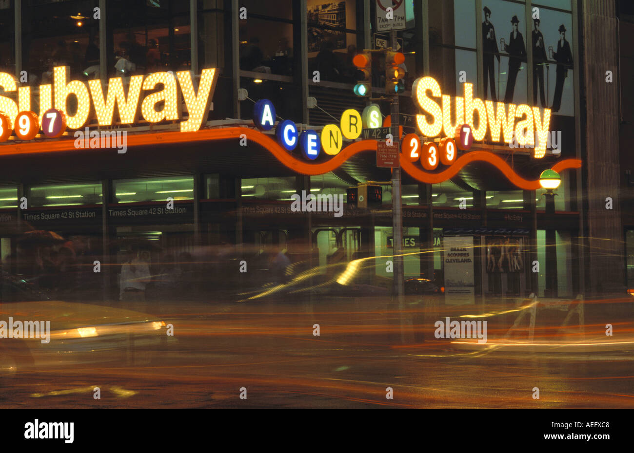 New York City subway sign at night Stock Photo - Alamy