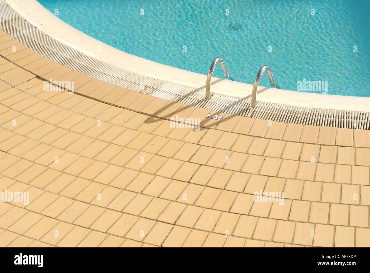 Contemporary patterned bold image of swimming pool steps seen above the ...