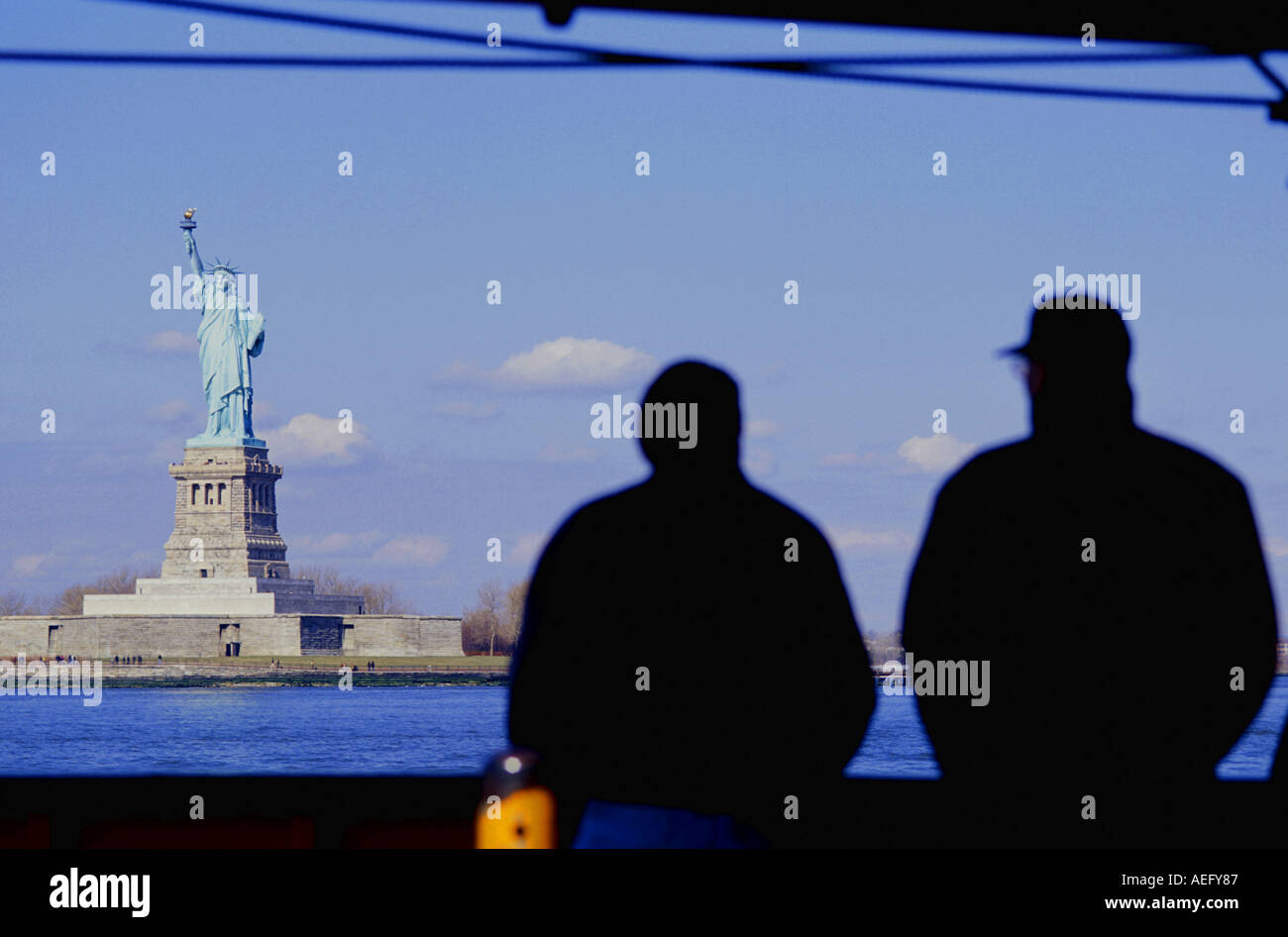 Tourists looking at Statue of Liberty from boat Stock Photo - Alamy
