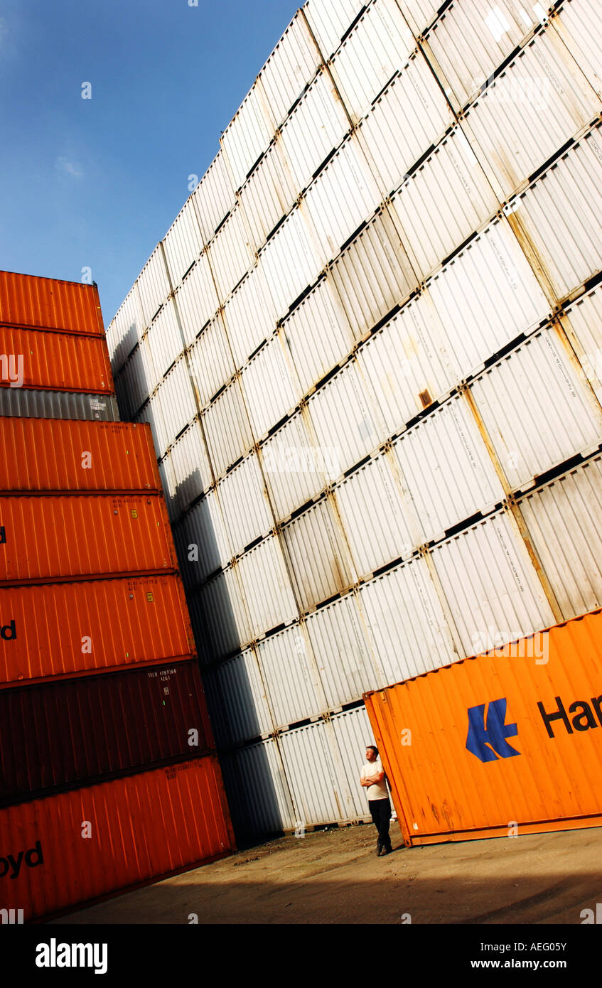 Man leaning on shipping container Stock Photo - Alamy