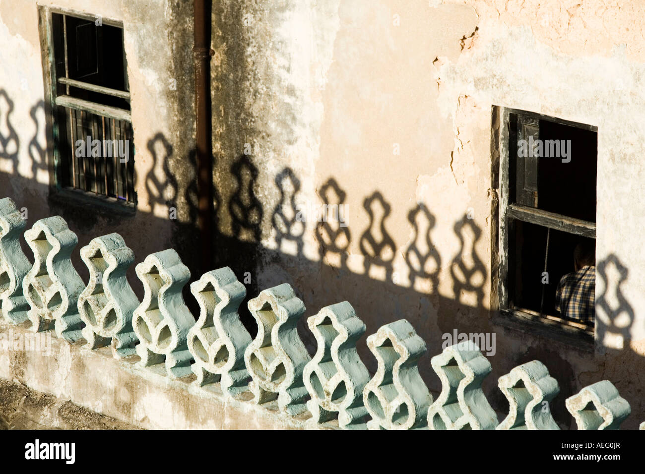 Architectural detail of mosque casting shadow on next building Lamu ...