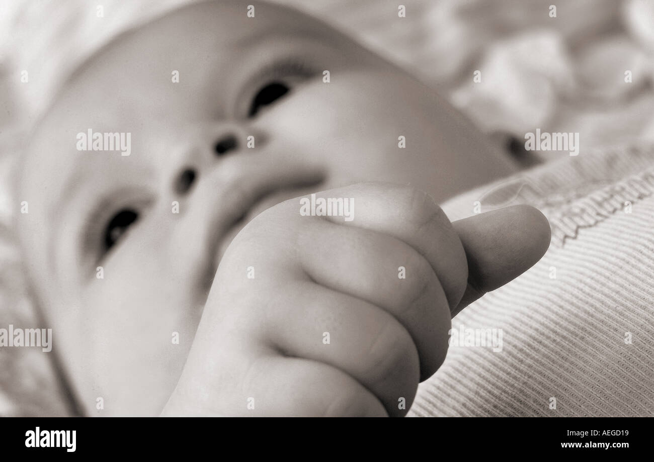 Baby finger small knuckles black hi-res stock photography and images ...