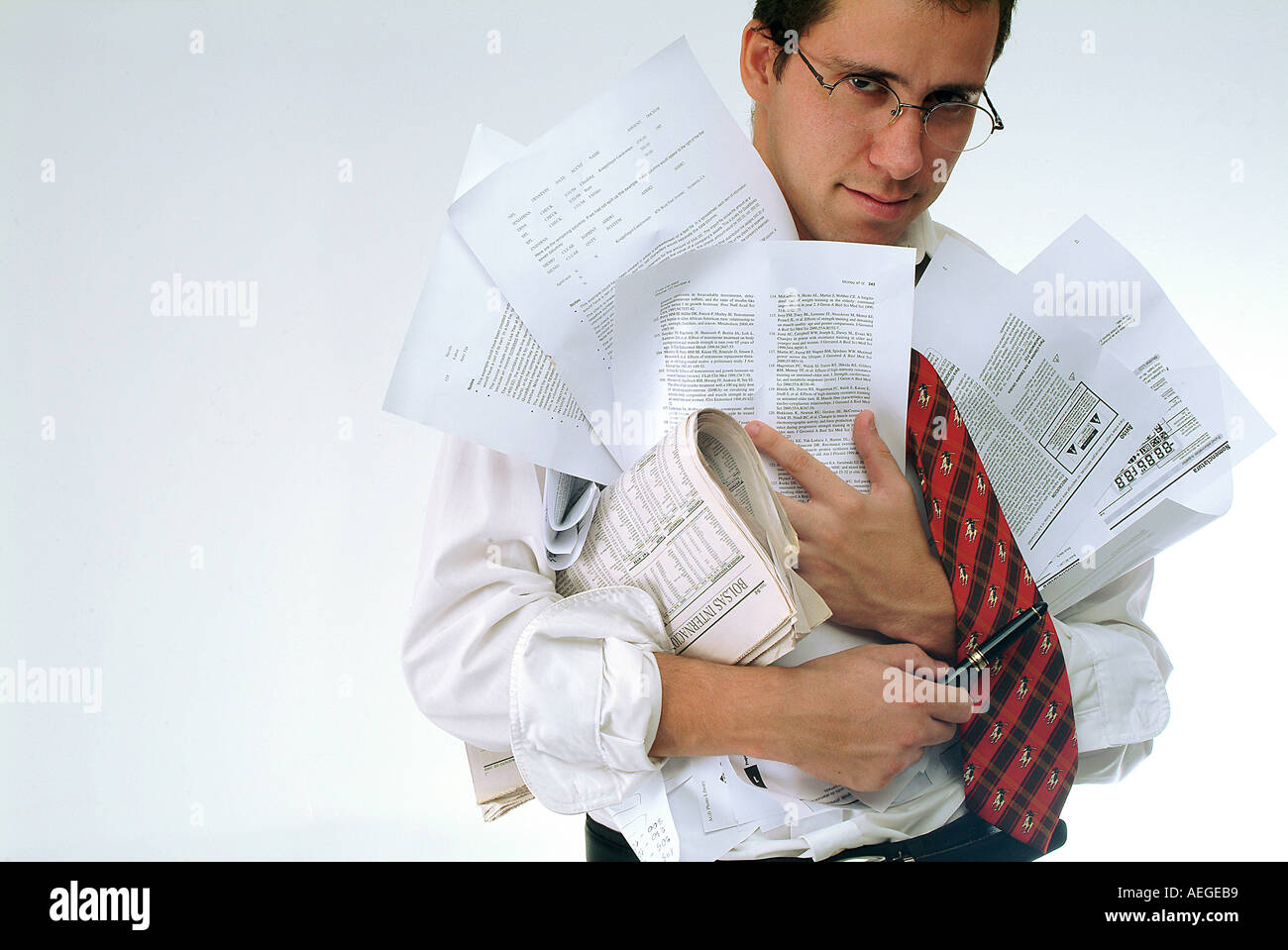 Overworked man pile of papers hi-res stock photography and images - Alamy