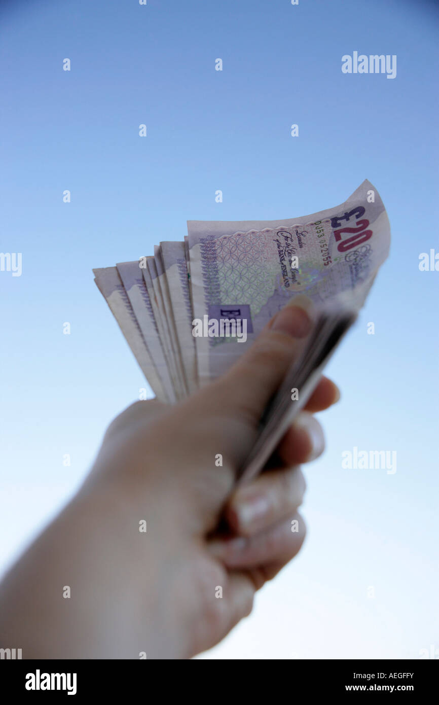 20 pound notes and hand hi-res stock photography and images - Alamy