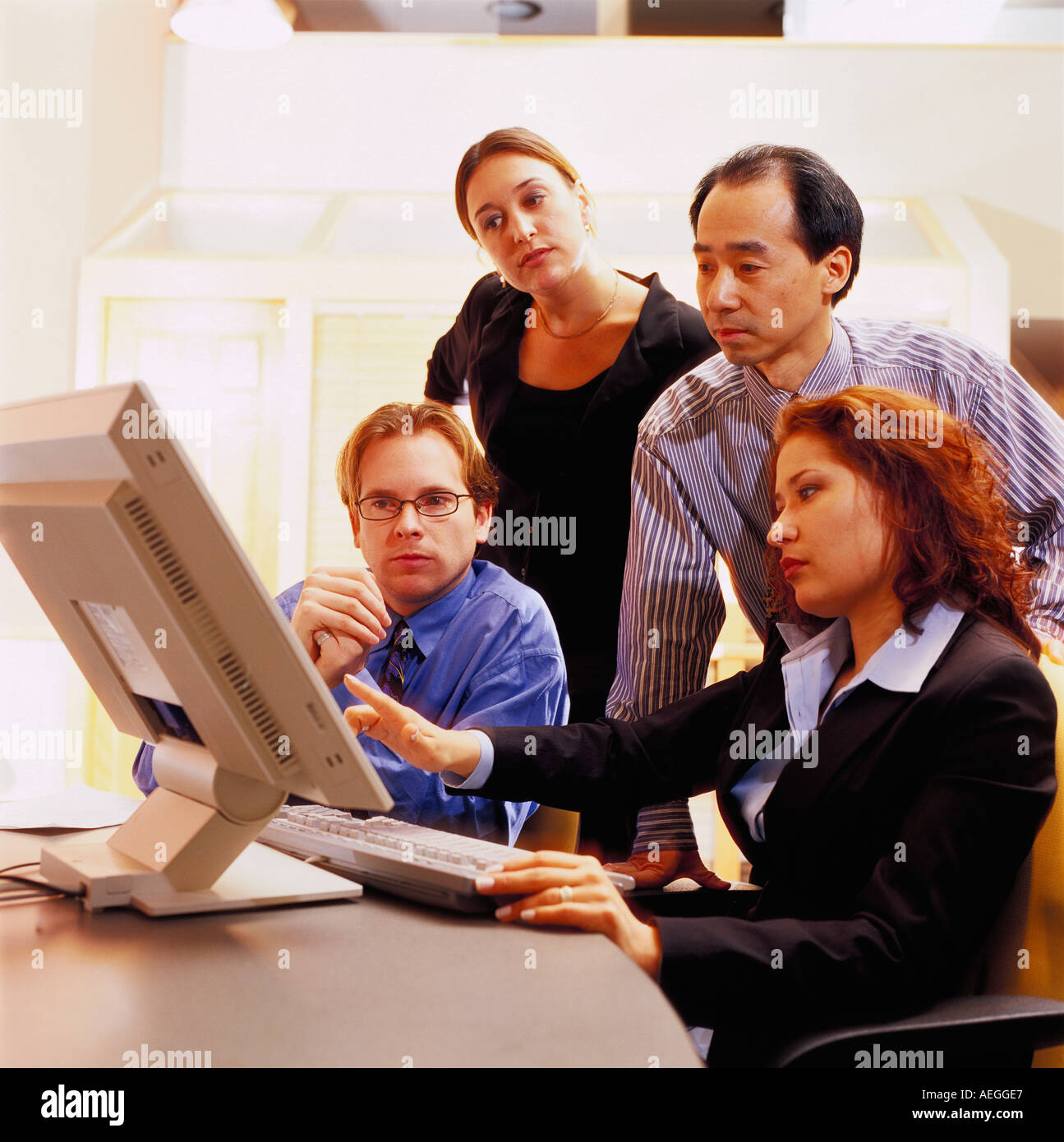 Co workers around computer hi-res stock photography and images - Alamy