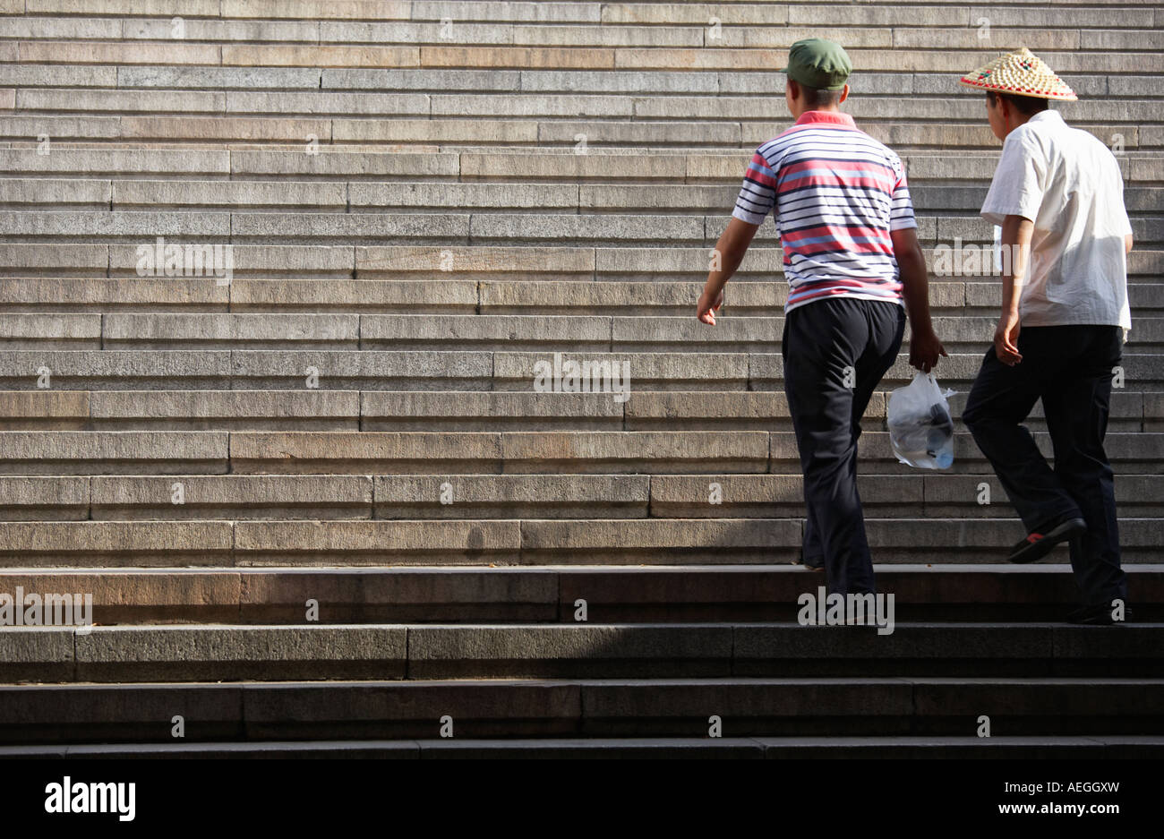 Chinese man walking up stairs hi-res stock photography and images - Alamy
