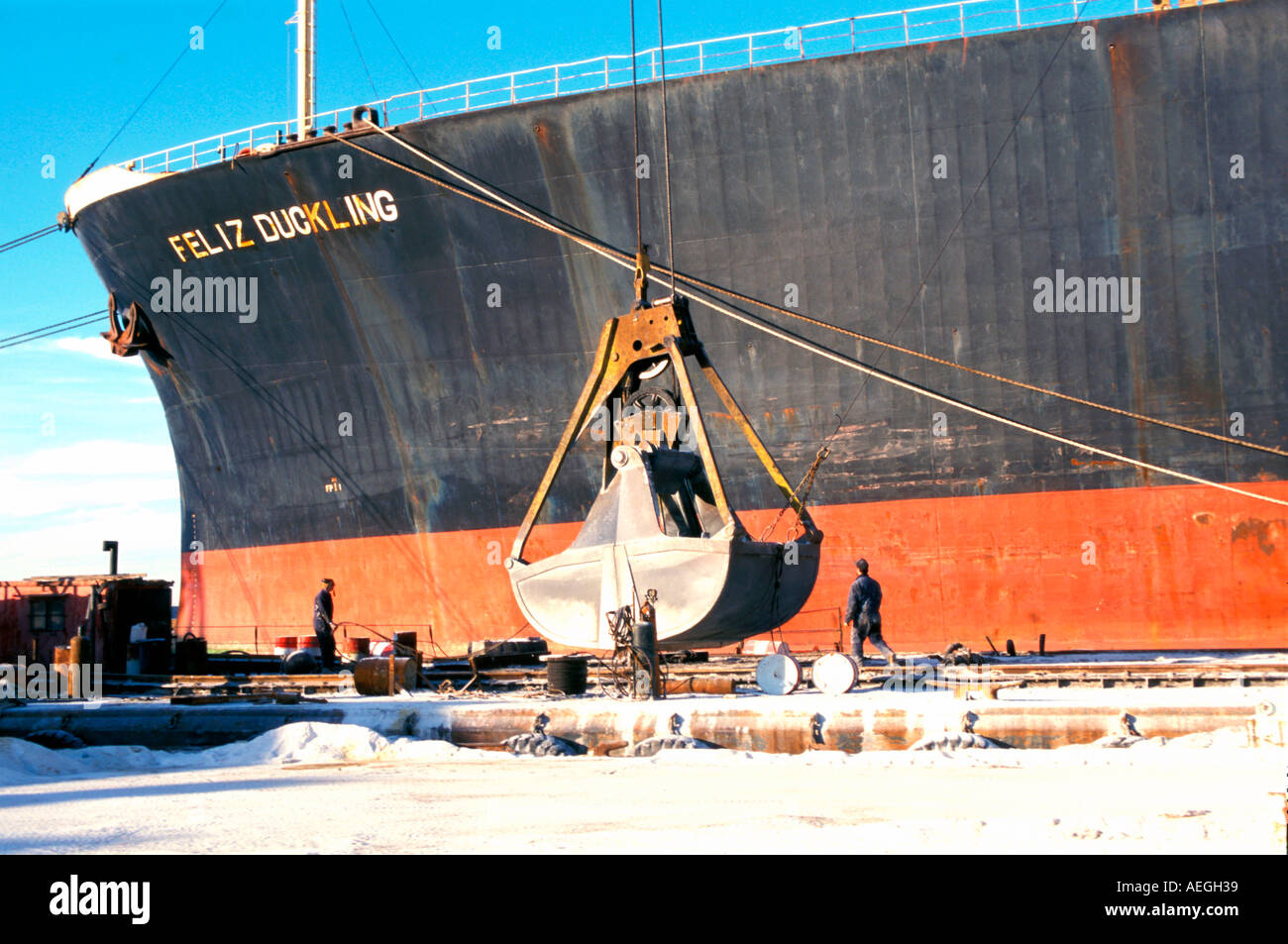 Freighter ship on loading dock Stock Photo - Alamy