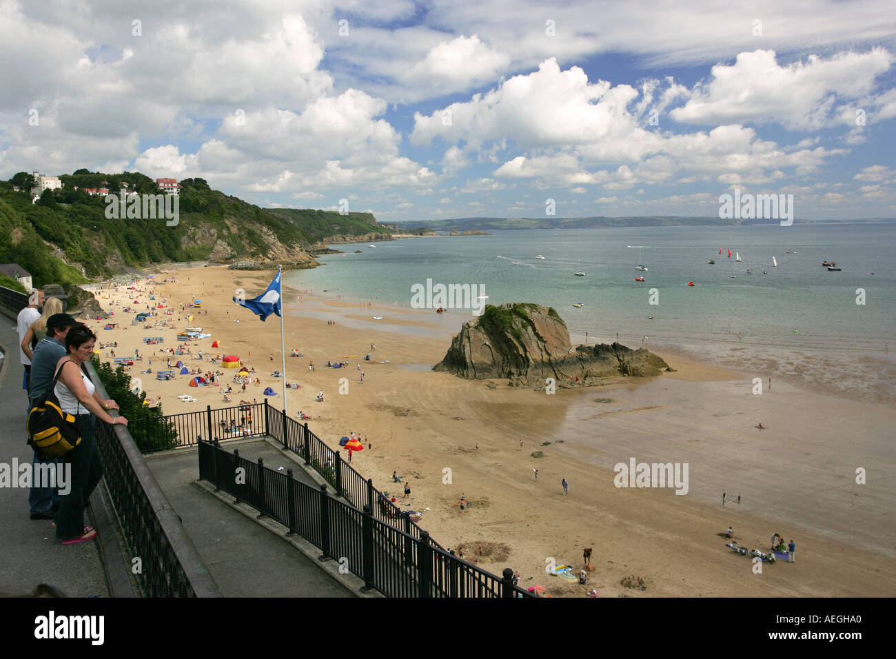Blue flag for clean bathing water flies on the North beach at Tenby ...