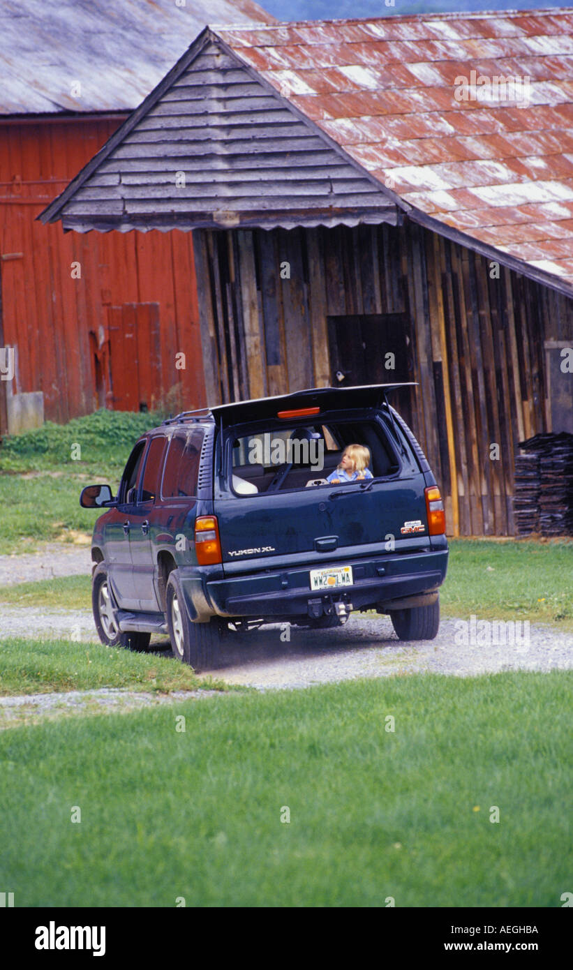 SUV in front of Farm Stock Photo - Alamy