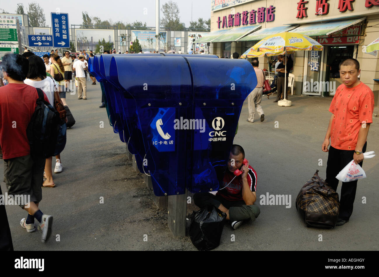 Chinese people make phone call at CNC booth in Tianjin raiway station ...