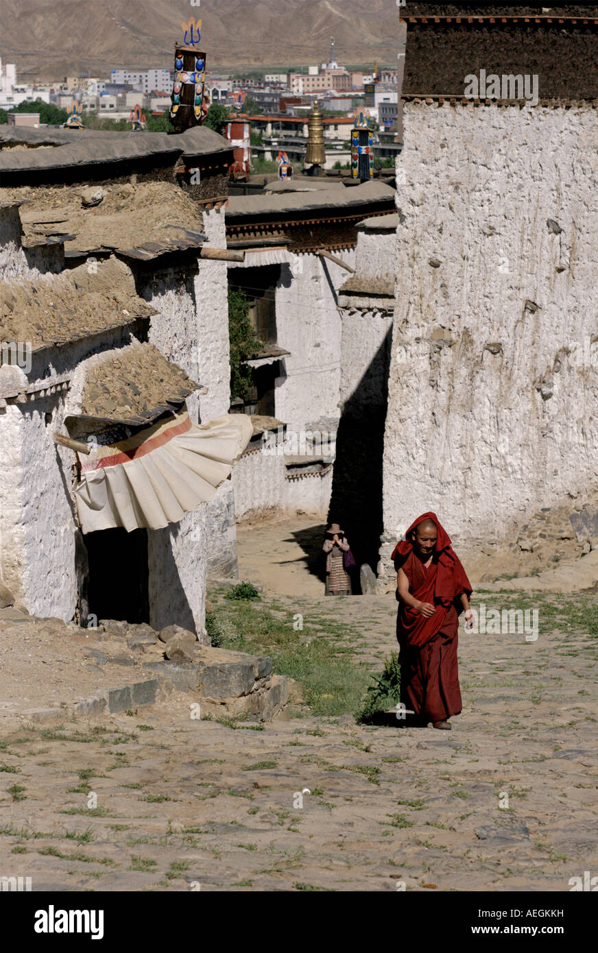 Monk walking around Tashilhunpo monastery Shigatse Stock Photo - Alamy