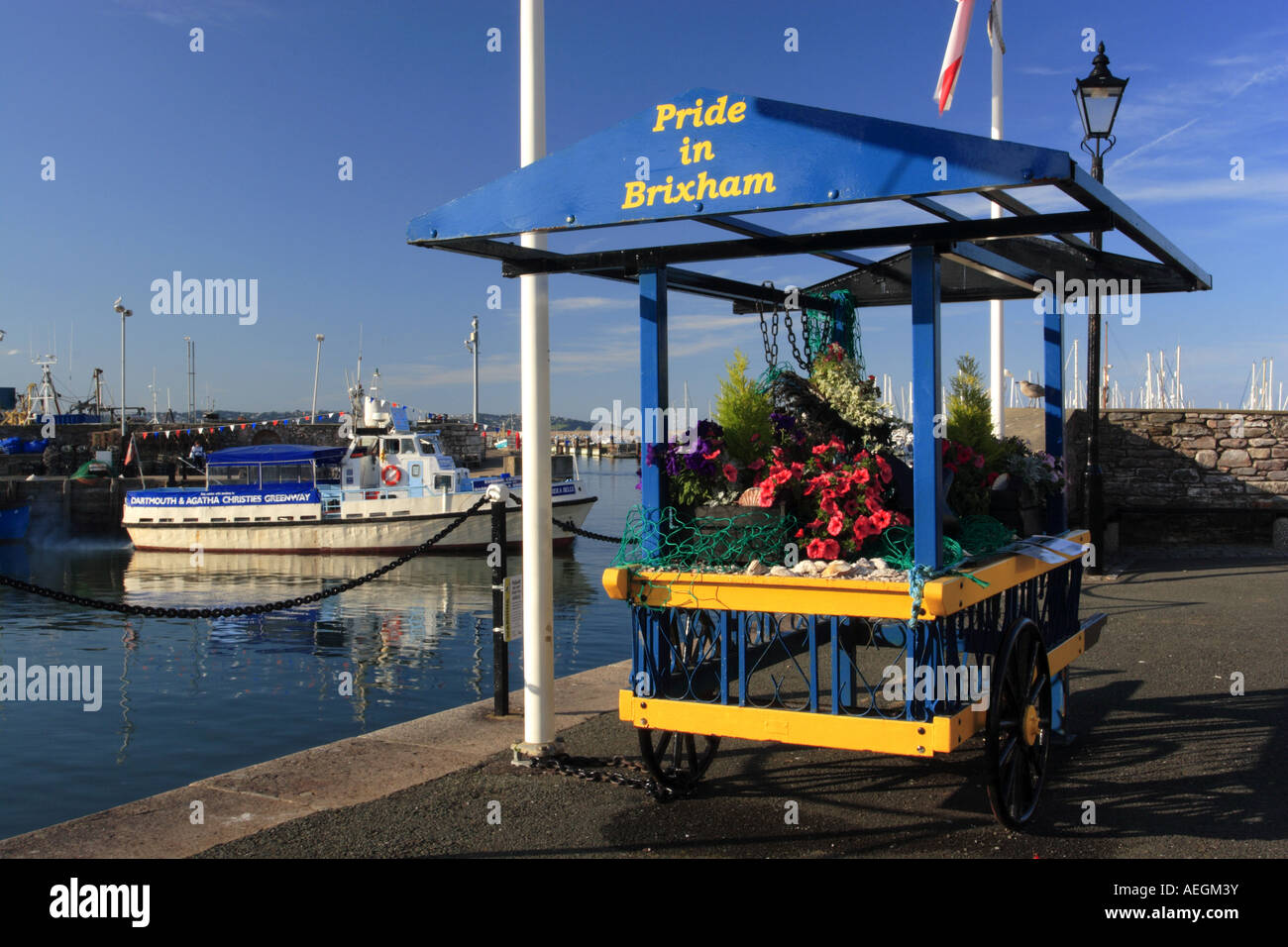 FLORAL DISPLAY BARROW AT BRIXHAM HARBOUR Stock Photo - Alamy