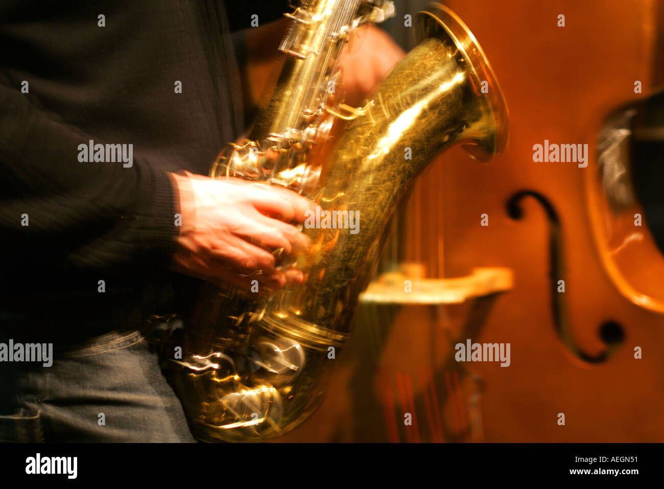 Blur of saxophone and upright bass Stock Photo - Alamy