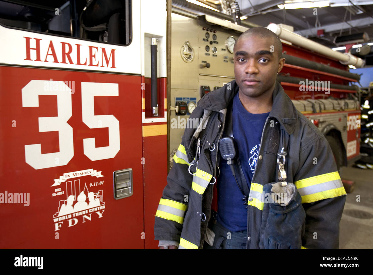 Fireman in front of truck Stock Photo - Alamy