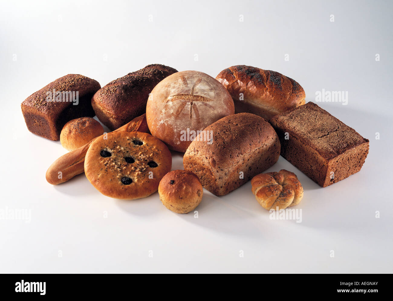 A selection of organic breads on a white background Stock Photo - Alamy