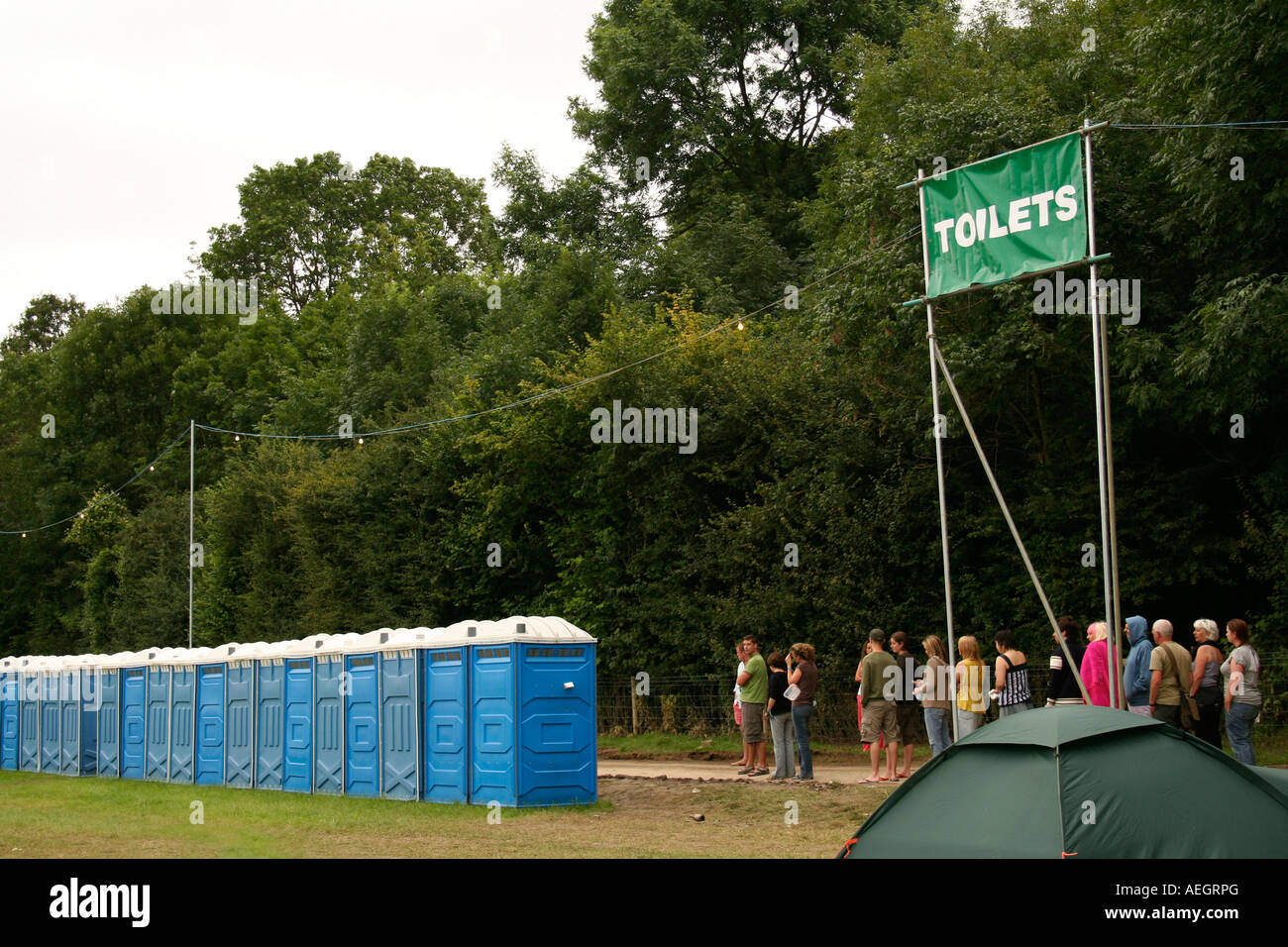 Festival toilets queue Stock Photo - Alamy