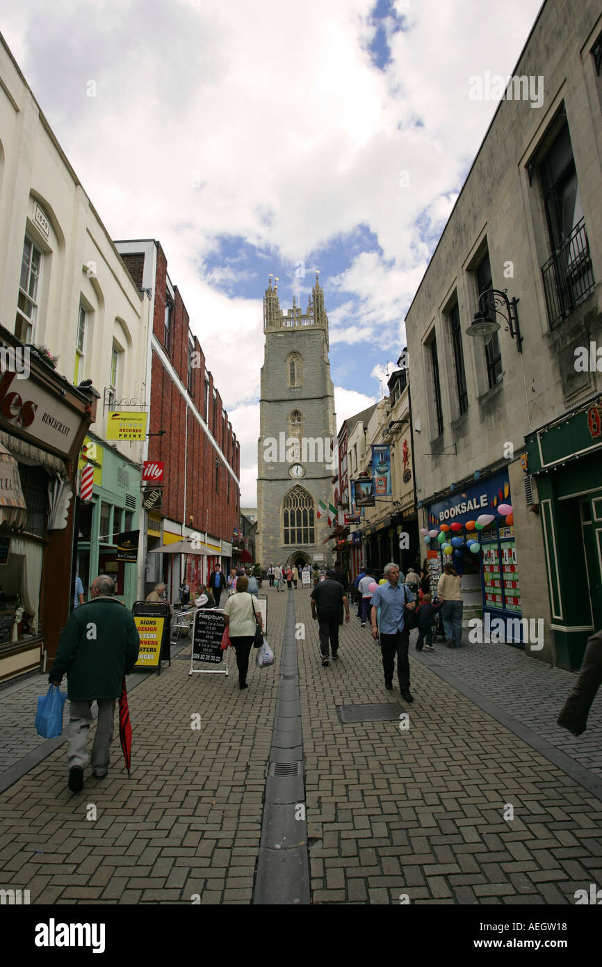 Tourists walk down a cobbled shopping street in Cardiff city centre ...