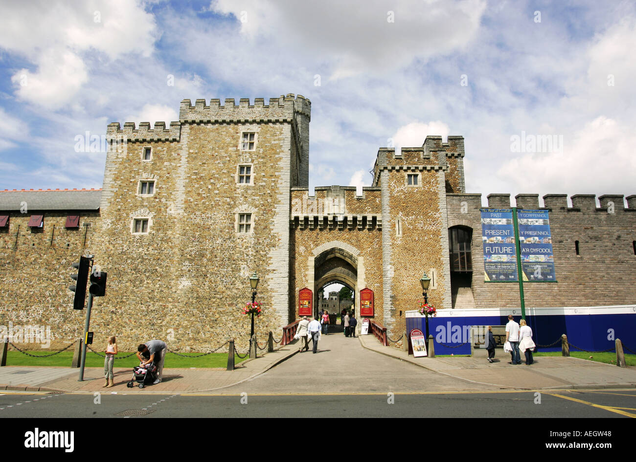 Tourists walk through the entrance to Cardiff Castle in the heart of ...