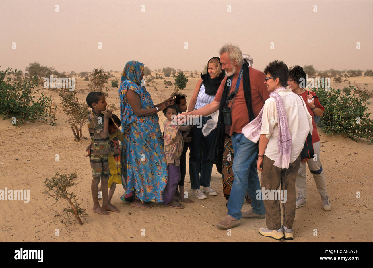 Mali Bamba Woman and children of Tuareg tribe standing with tourists ...