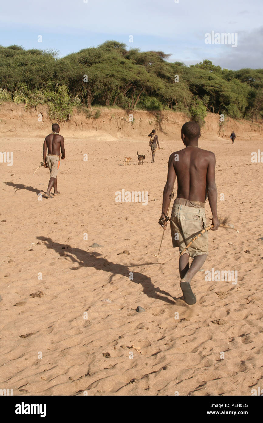 Hunter gatherer Hadza tribe hunting with bows and arrows near Lake ...