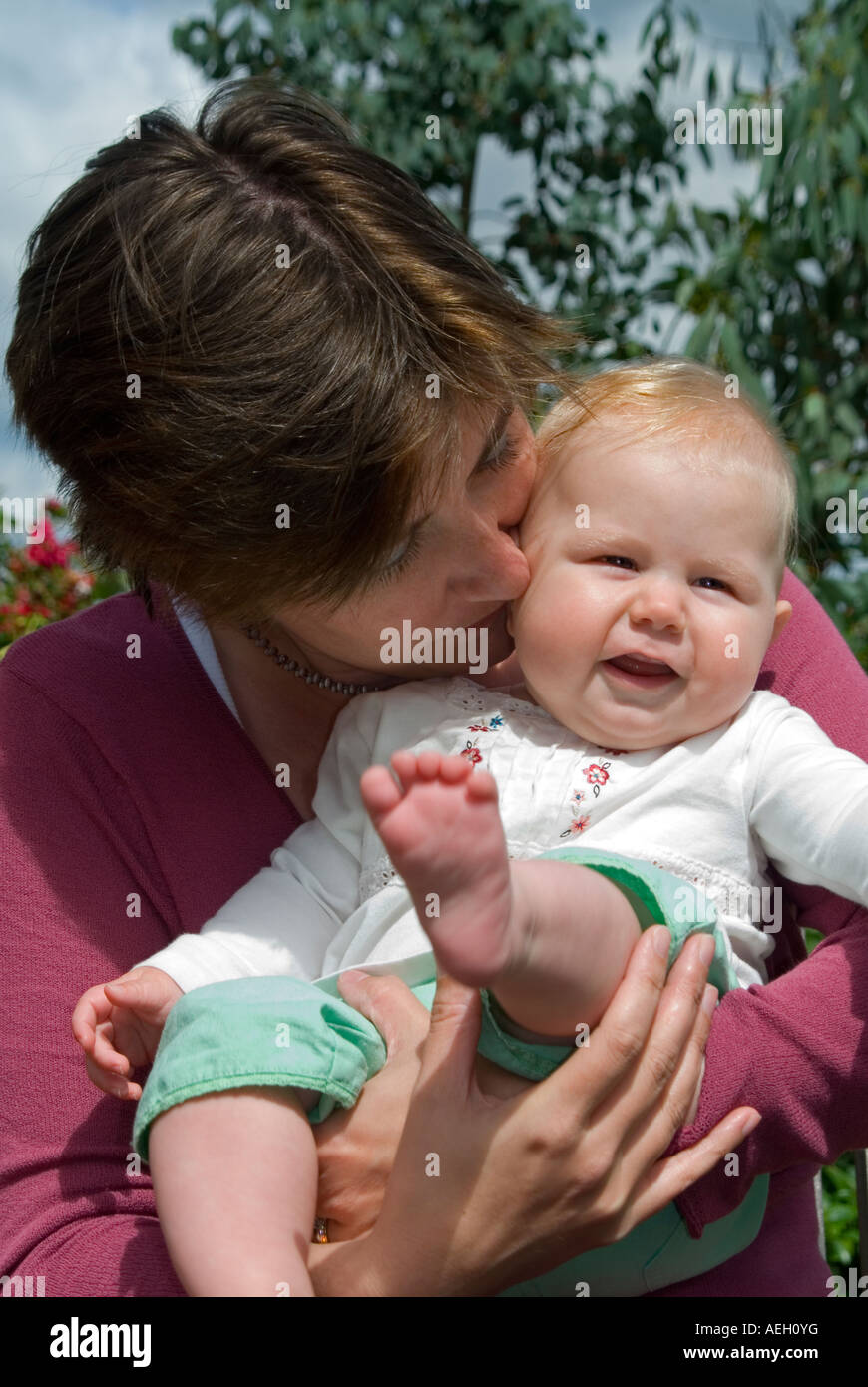 Adult nibbling baby hi-res stock photography and images - Alamy
