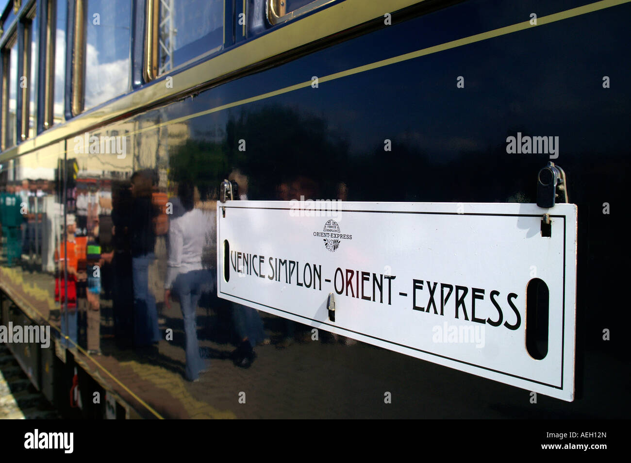 Orient express luxury train wagon carriage with crowd people reflected ...