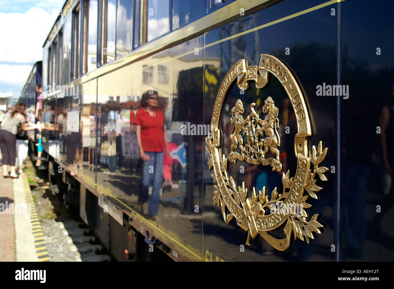 Orient express luxury train wagon carriage with crowd people reflected ...