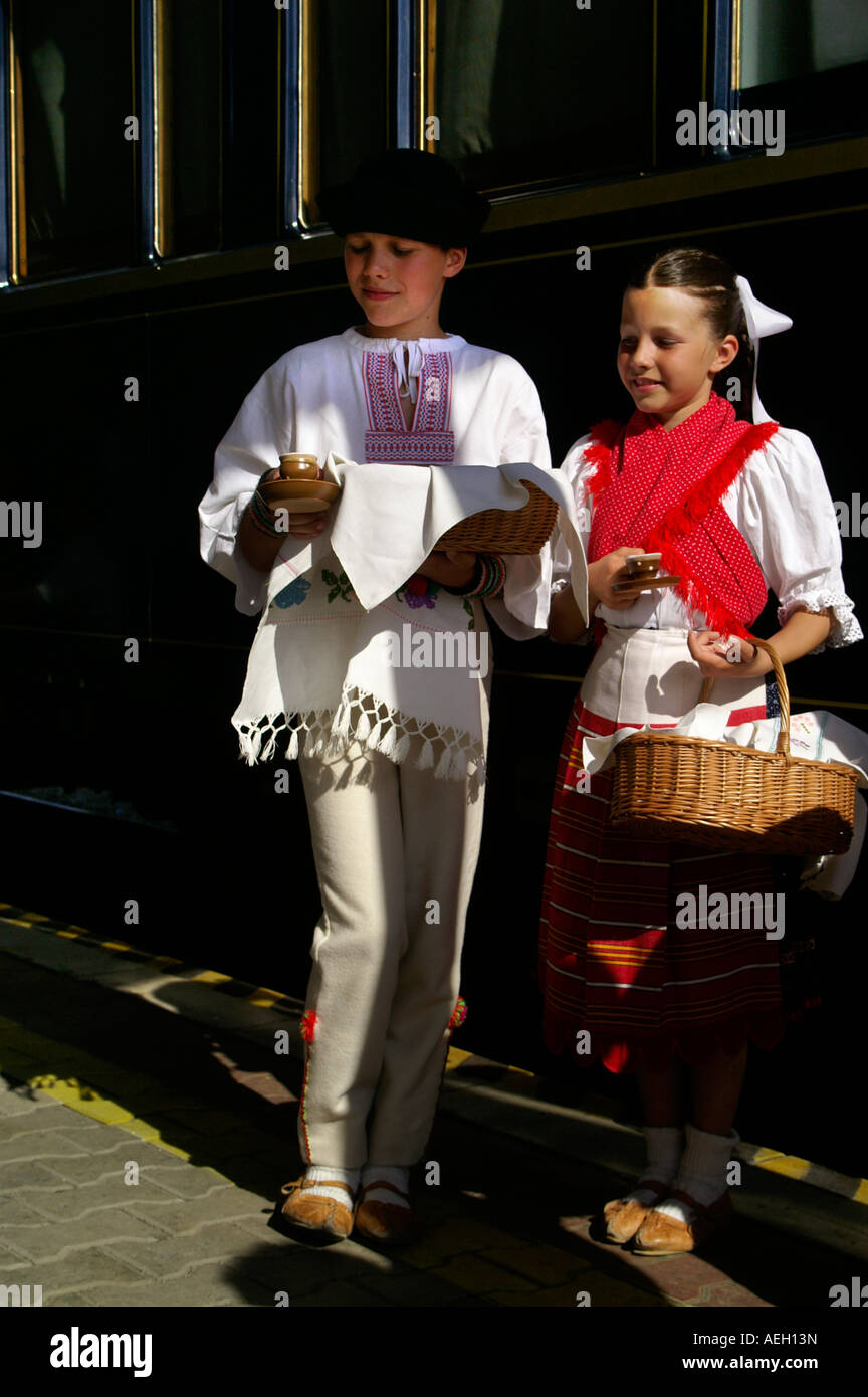 Boy and girl children kids welcome guests with Slavonian tradition ...