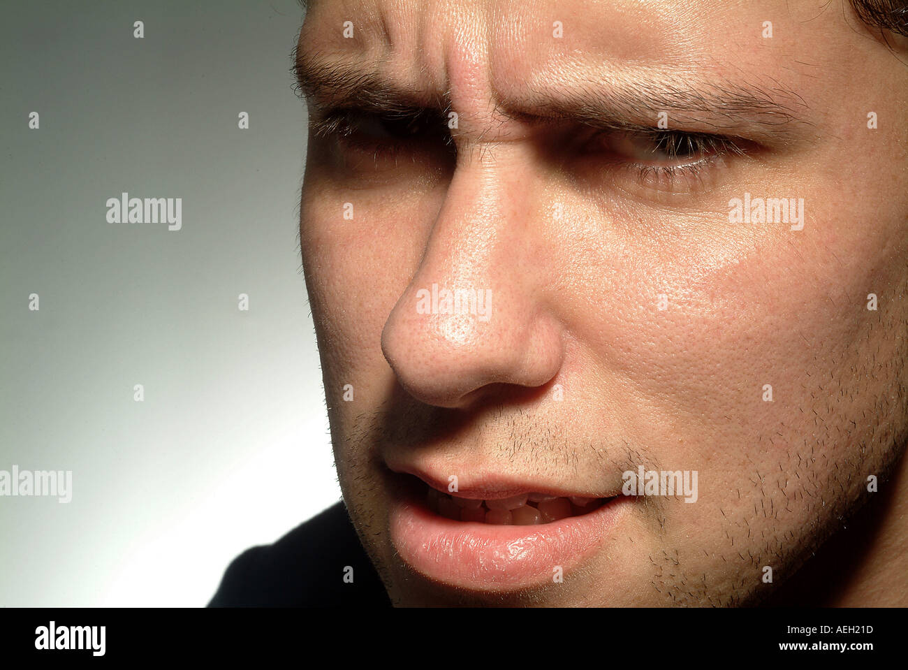 Expressions man male young adult 20 25 close up face eyes nose mouth ...