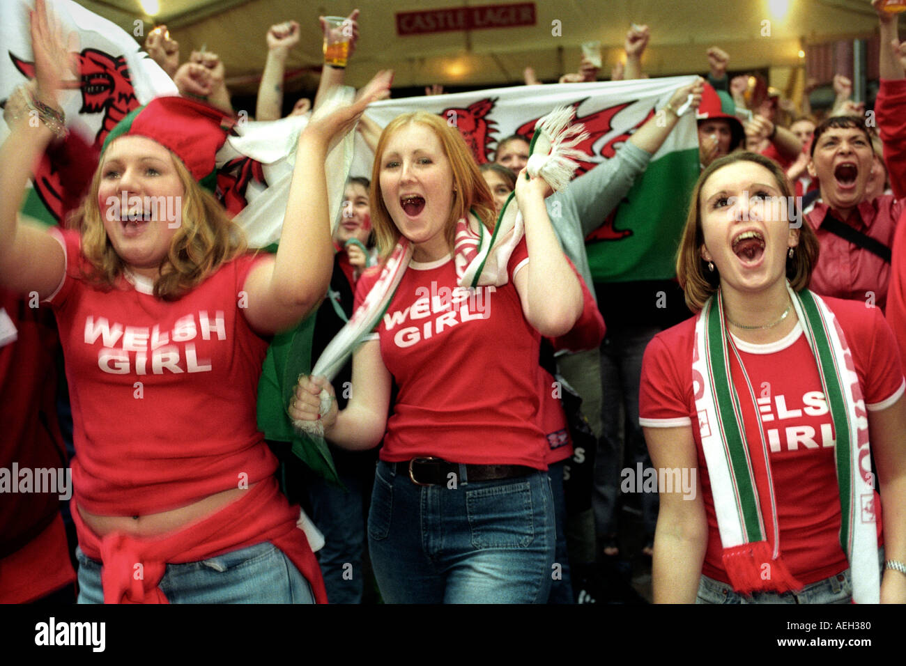Young women Welsh rugby fans celebrating watching Wales international ...