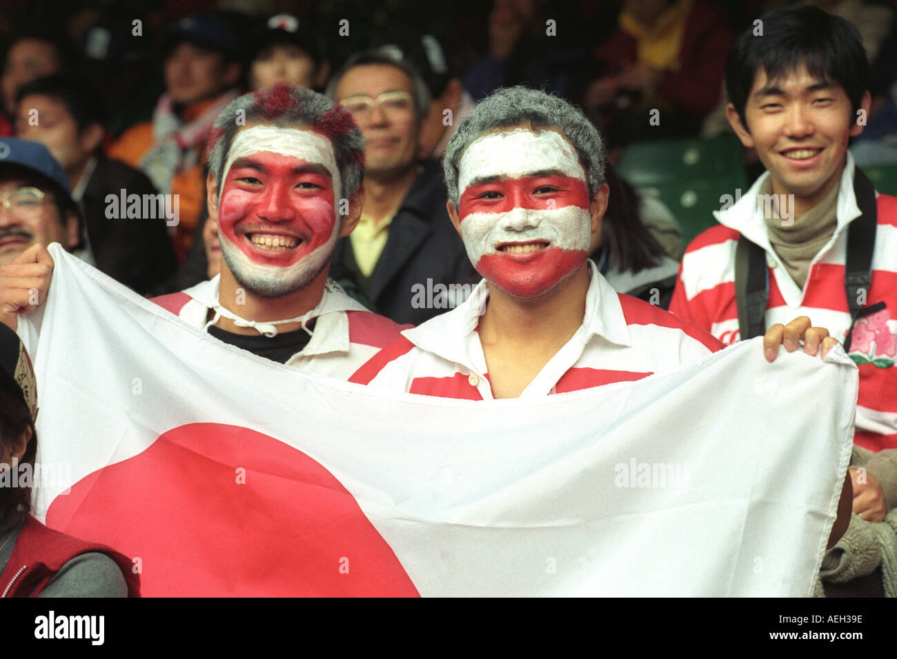 Japanese rugby fans with painted faces supporting their team at an ...