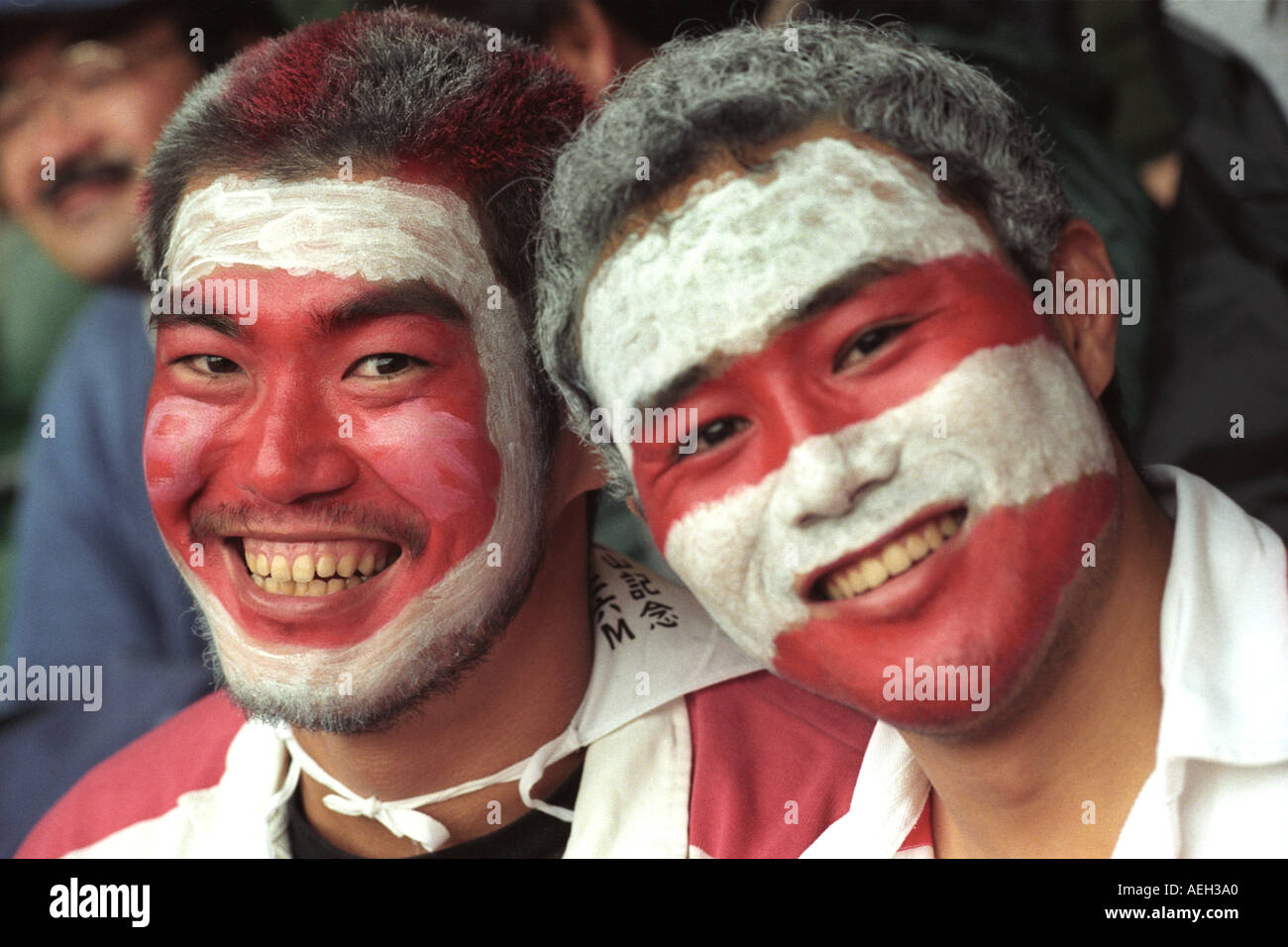 Japanese rugby fans with painted faces supporting their team at an ...