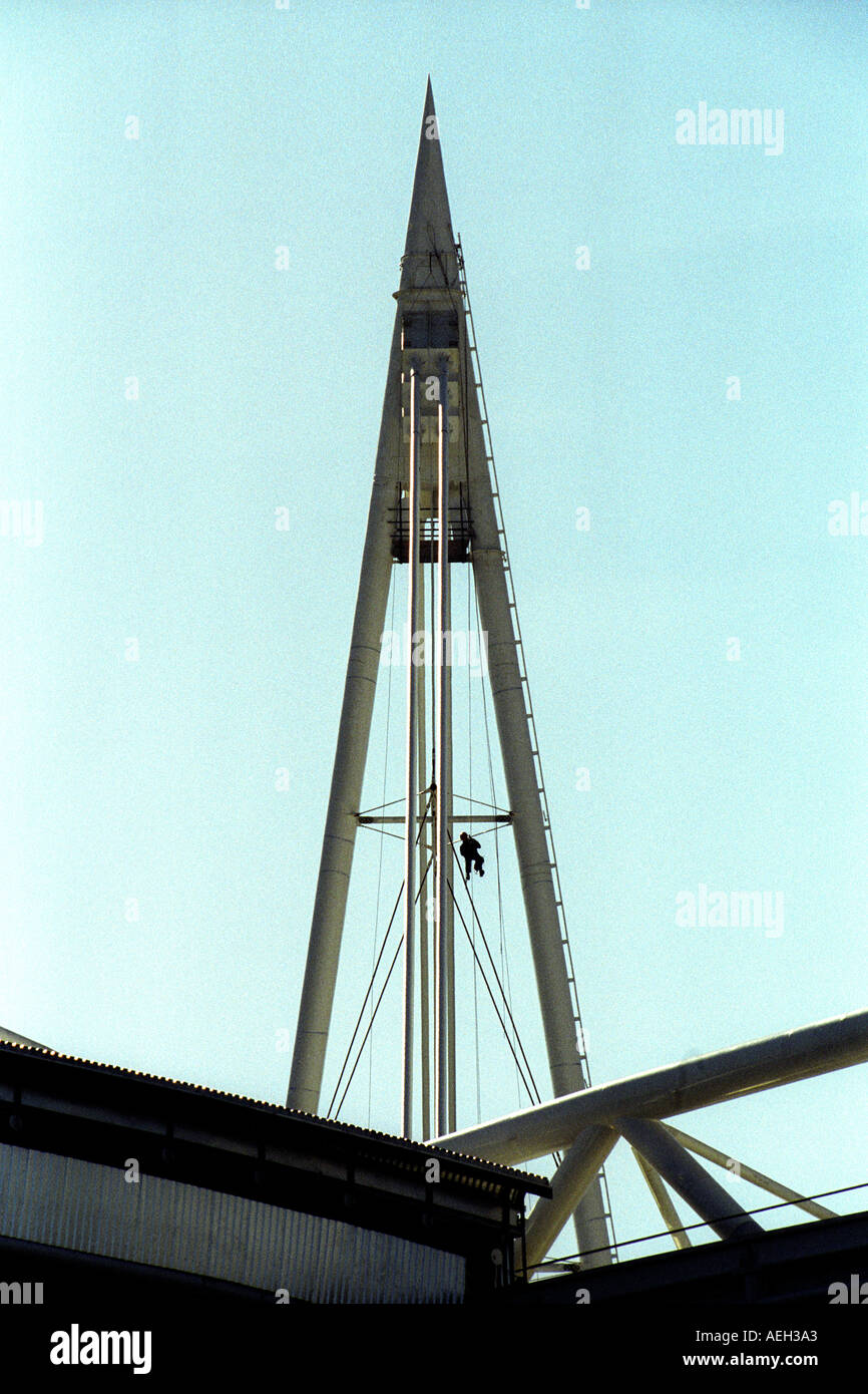 Rope access technician working on one of the spires of the Millennium ...