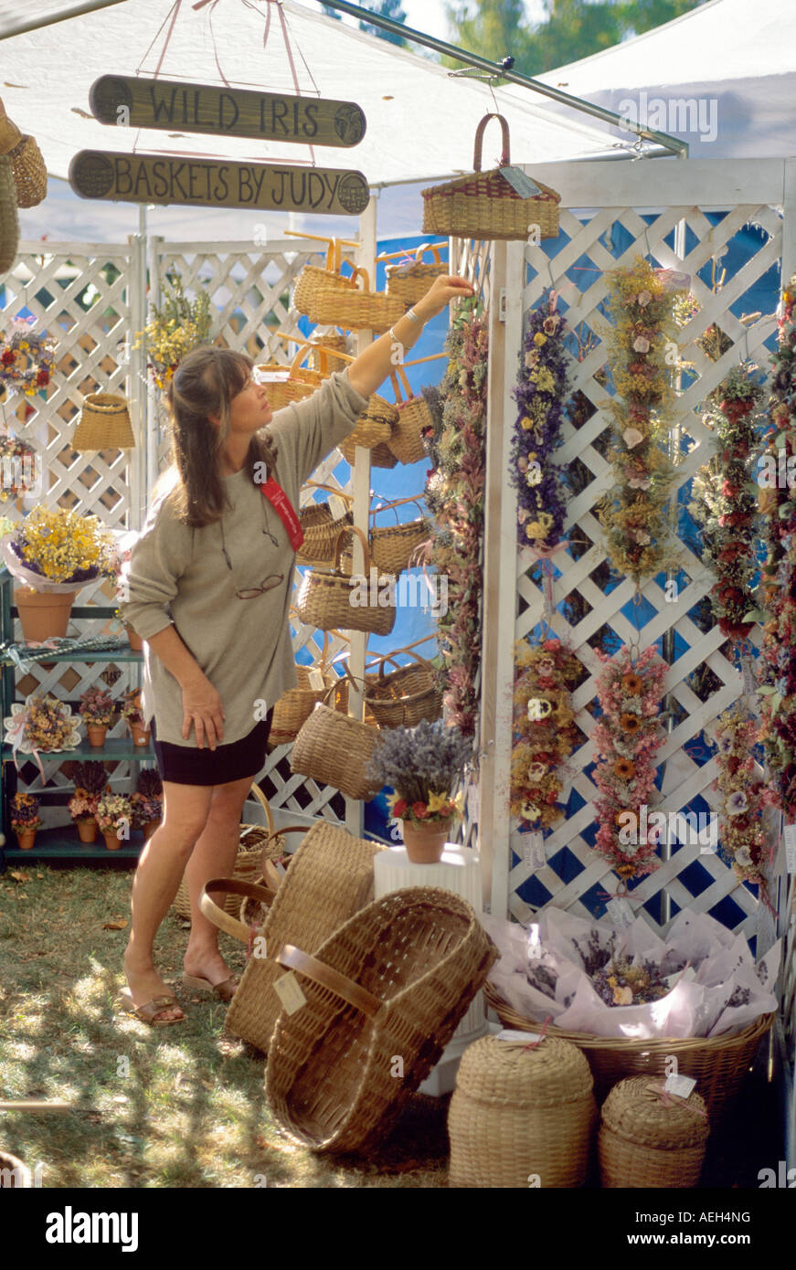 Vendor arranging baskets at Corvallis Fall Festival Oregon Stock Photo ...